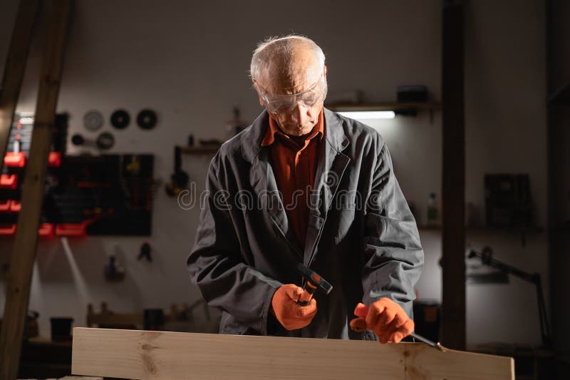 Senior Carpenter Using Hammer Working in Workshop Stock Photo - Image ...