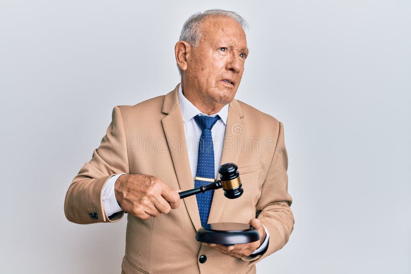 Senior Caucasian Judge Man Using Gavel Clueless and Confused Expression ...
