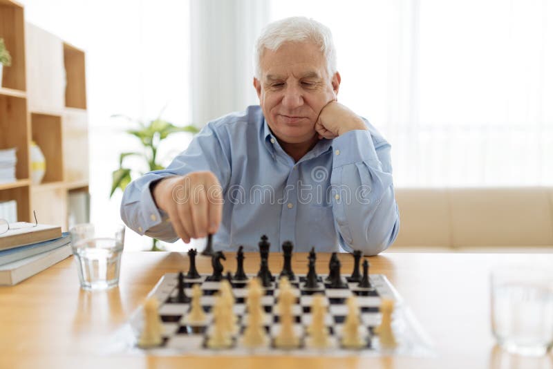 Senior Chess Player Holding a Trophy Indoors Stock Photo - Image of ...