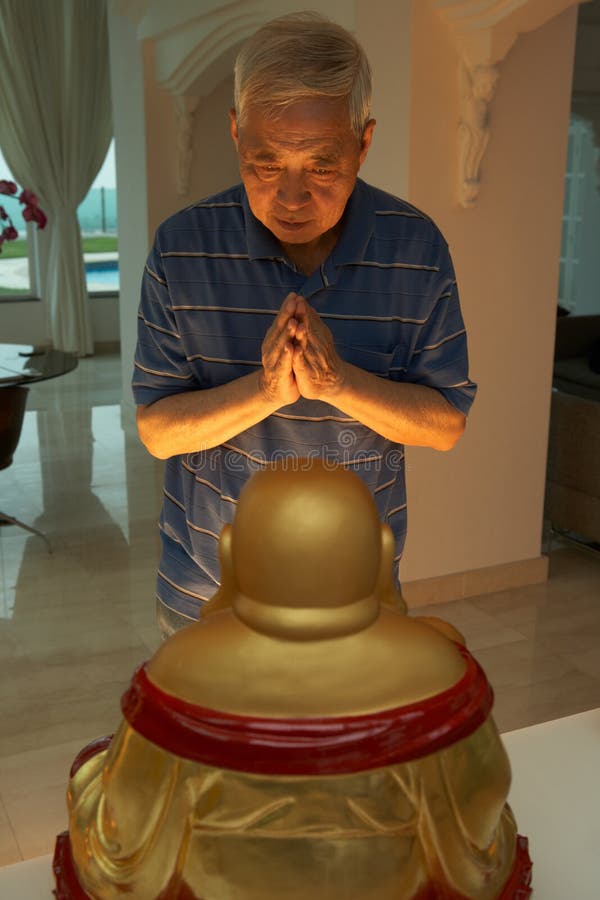 Senior Chinese Man Praying To Statue of Buddha Stock Image - Image of ...
