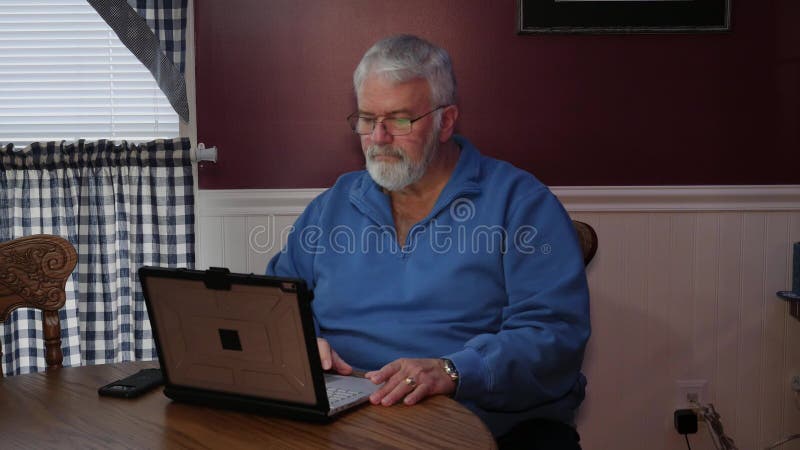 Senior Citizen Happy Using a Computer and Technology To Do daily ...