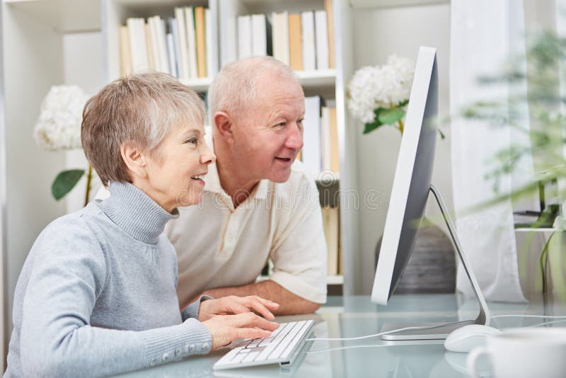 Senior Citizens Look PC with Curiosity Stock Photo - Image of person ...