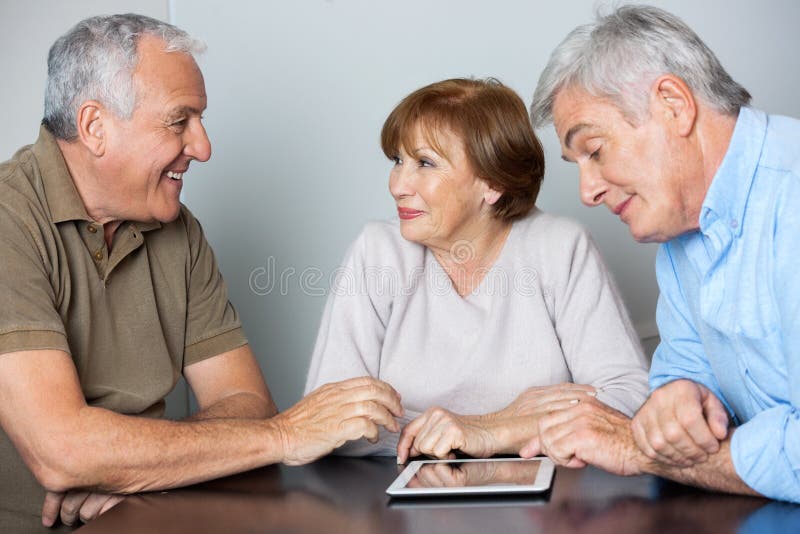 Senior Classmates Using Digital Tablet in Computer Class Stock Image ...