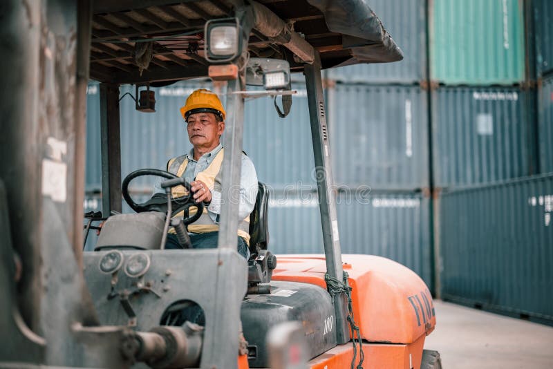 Senior Container Controllers Navigate and Drive Folklift To Transfer ...