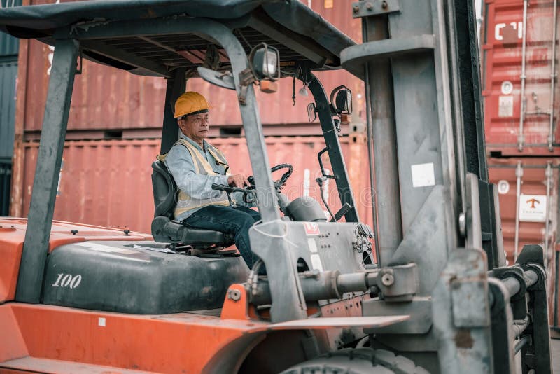 Senior Container Controllers Navigate and Drive Folklift To Transfer ...