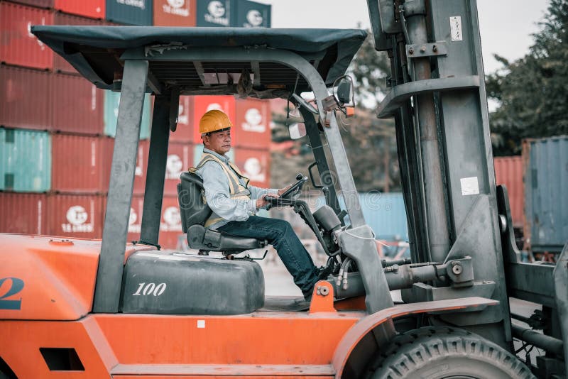 Senior Container Controllers Navigate and Drive Folklift To Transfer ...