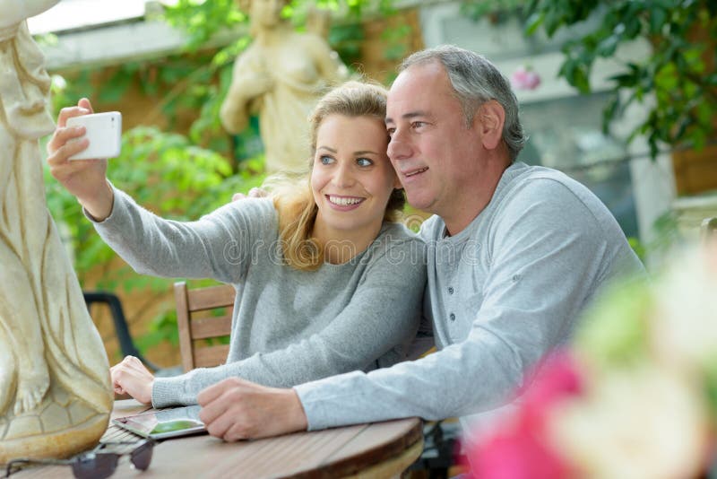 Senior couple in bar stock image. Image of relationship - 269559939