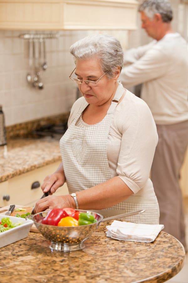 Senior Couple Cooking in the Kitchen Stock Image - Image of active ...