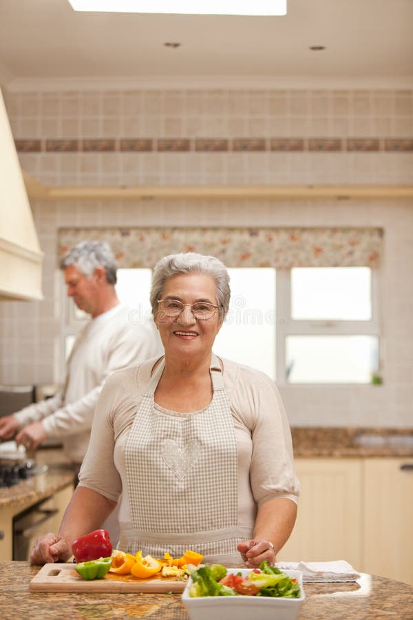 Senior couple cooking stock image. Image of male, knife - 8762131