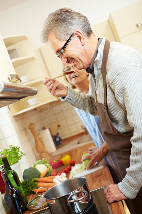 Couple cooking together stock image. Image of lunch, love - 18670843