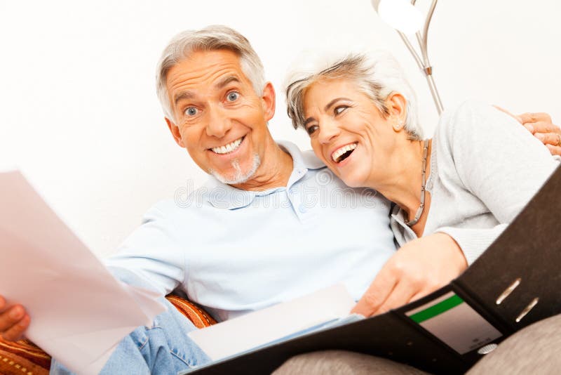 Senior Couple Doing Paperwork Stock Image - Image of bright, happy ...