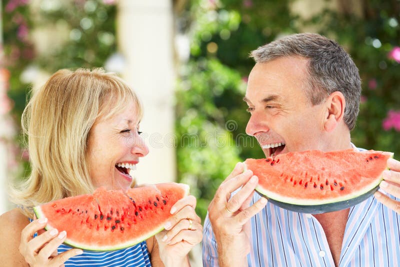 Senior Couple Enjoying Slices of Water Melon Stock Image - Image of ...