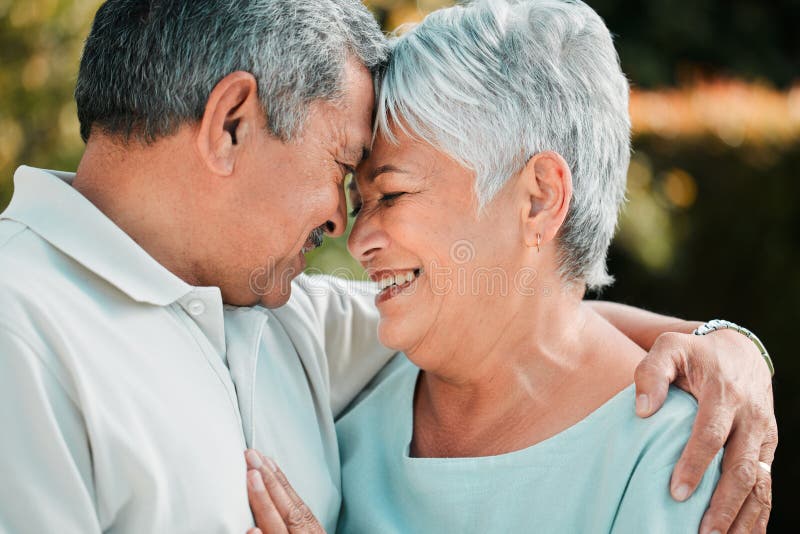 Senior Couple Forehead Touch And Love Outdoor In Park Garden And