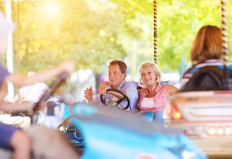 Senior Couple at the Fun Fair Stock Image - Image of hobby, light: 60395553