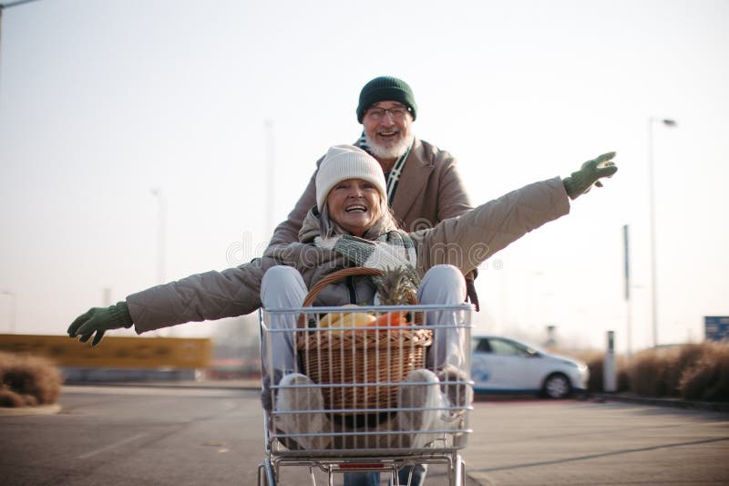 Senior Couple Going Home from Grocery Store, Having Fun. Stock Photo ...