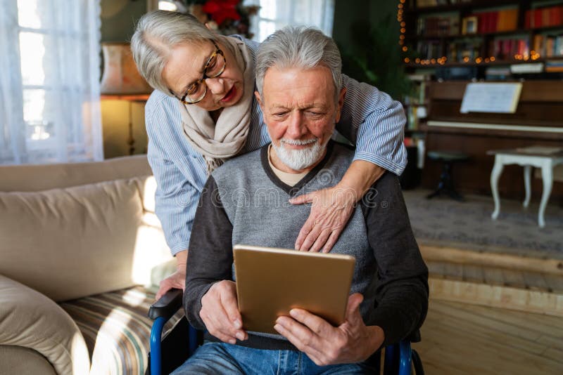 Senior Couple Having Fun and Laughing while Using Their Tablet Pc ...