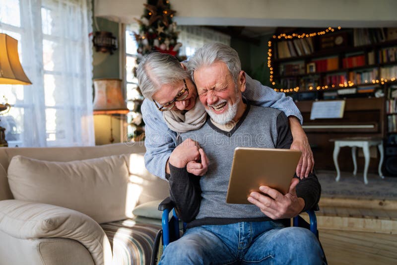 Senior Couple Having Fun and Laughing while Using Their Tablet Pc ...