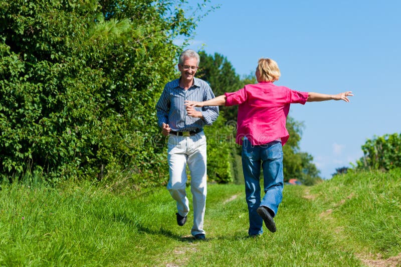 Senior couple having walk stock image. Image of trust - 21345765