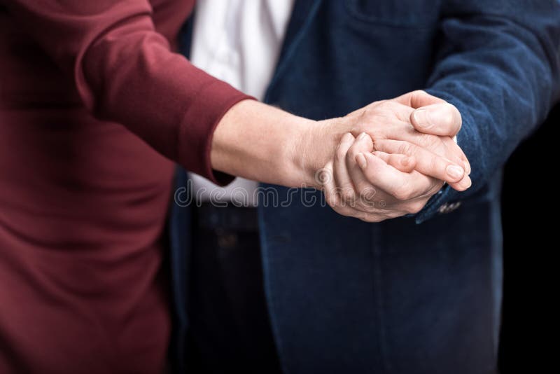 Senior Couple Holding Hands while Dancing Stock Photo - Image of ...