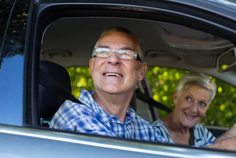 Senior Couple Looking Outside Car Window Stock Image - Image of female ...