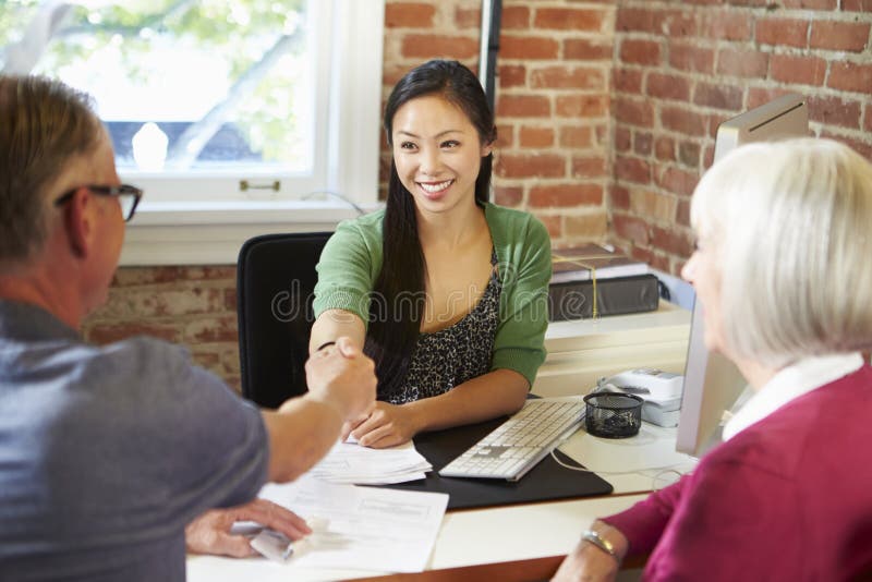 Senior Couple Meeting with Financial Advisor in Office Stock Image ...