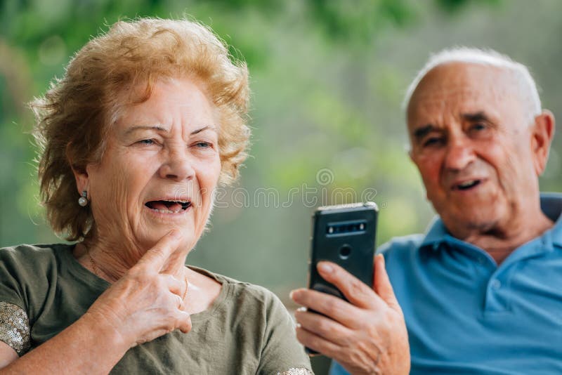 Senior Couple with Mobile Phone Stock Image - Image of buying ...