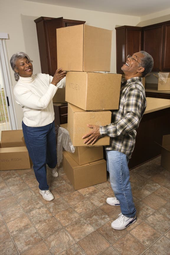 Senior Couple with Moving Boxes Stock Image - Image of full, indoors ...