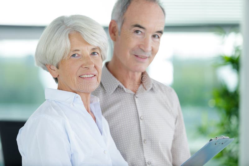 Senior couple in office stock photo. Image of businesswoman - 173517500