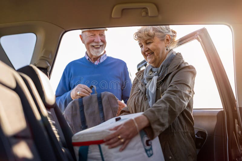 Senior Couple Packing a Car Stock Photo - Image of outside, healthy ...
