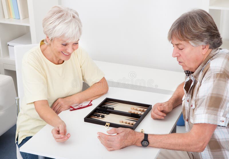 Senior Couple Playing Backgammon Stock Image - Image of love, amusement ...