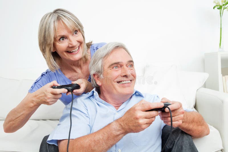 Senior Couple Playing Video Games Stock Photo - Image of inside ...