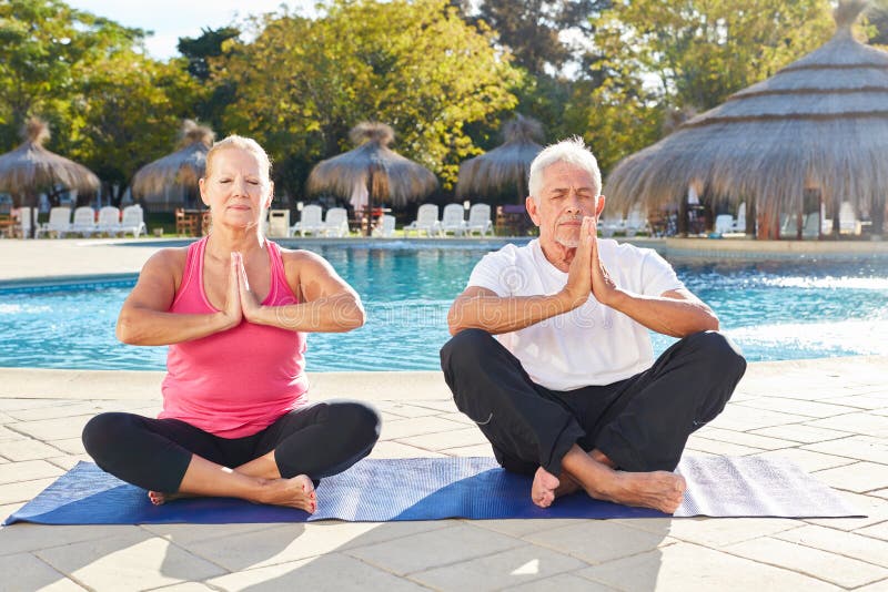 Senior Couple at the Pool is Doing a Meditation Stock Photo - Image of ...