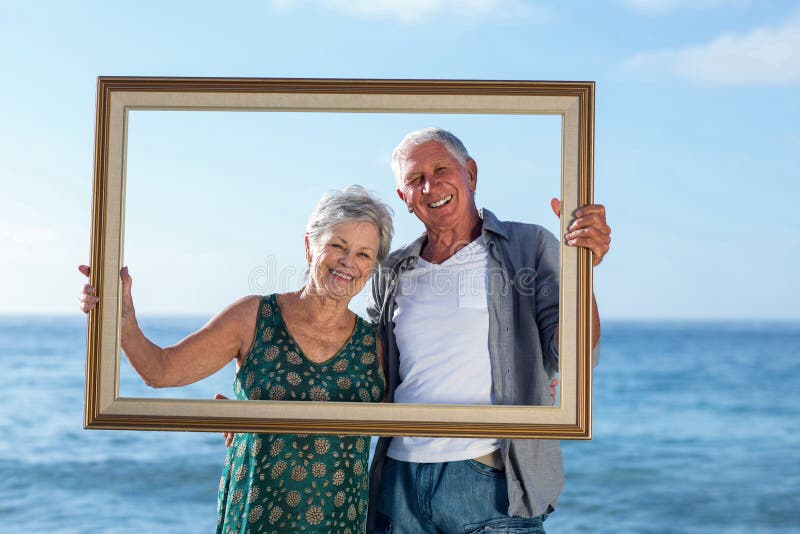 Senior Couple Posing with a Frame Stock Image - Image of people, senior ...
