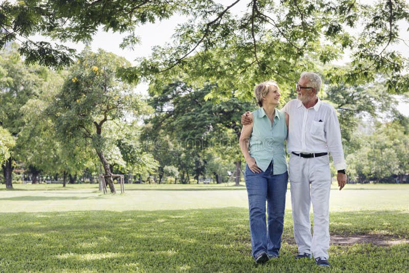 Mature couple bike riding. stock photo. Image of retirement - 5558764