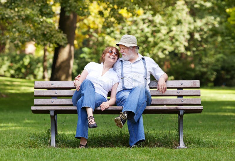 Senior Couple Sitting On A Park Bench Stock Image Image 40301281
