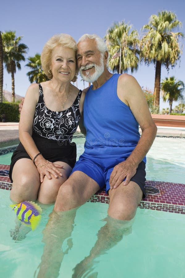 Senior Couple in Swimming Pool. Stock Photo - Image of seventy, outside ...