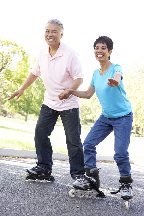 Couple Ice Skating on a Pond Stock Image - Image of exercise, fitness ...