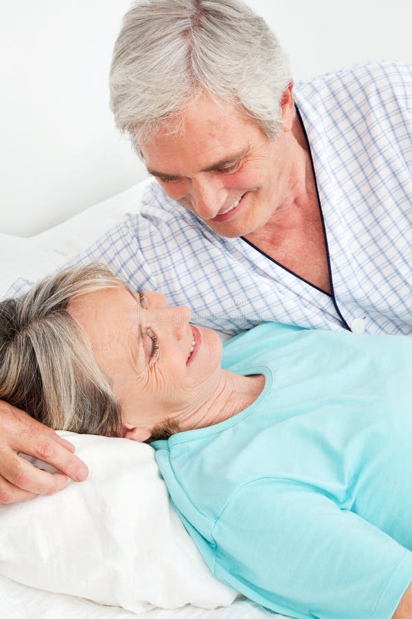 Old couple in bed stock photo. Image of companion, furniture - 4122488