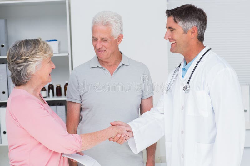 Senior Couple Smiling while Visiting Doctor Stock Image - Image of ...