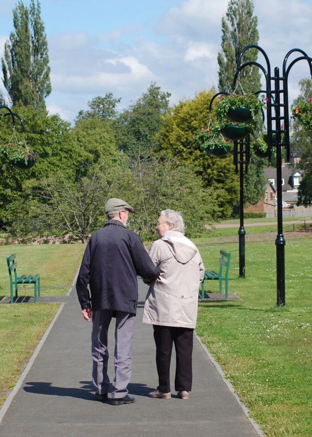 Senior Couple Strolling in the Park Stock Photo - Image of pensioner ...