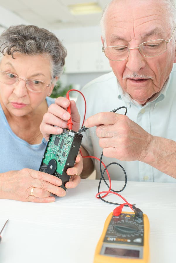 Elderly Couple Reading Newspaper Stock Image - Image of retired ...