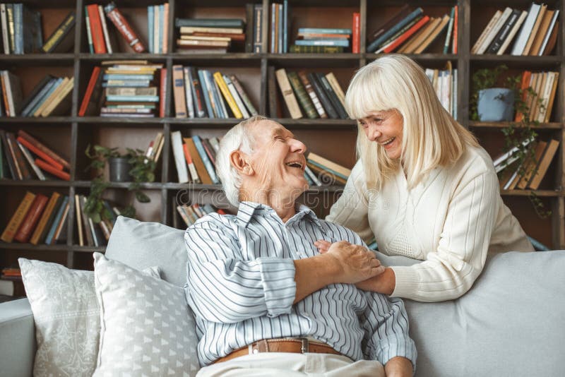 Senior Couple Together At Home Retirement Concept Looking On Each Other