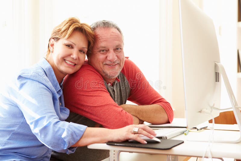 Senior Couple Using Computer at Home Stock Image - Image of senior ...