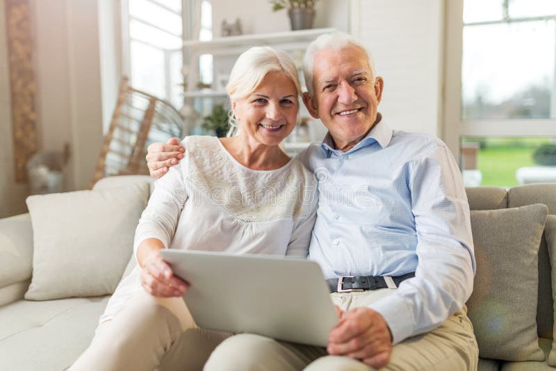 Senior Couple Using Laptop Computer at Home Stock Image - Image of ...