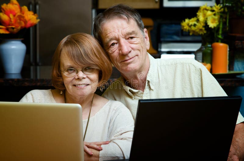 Senior Couple Using Laptop Computers At Home Stock Photo - Image of ...
