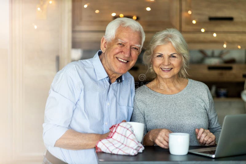 Happy Senior Loving Couple Relaxing with Laptop Computer at Park ...