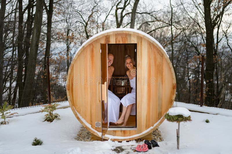 Senior Couple Using Small Sauna during Cold Winter Day. Spa Weekend ...
