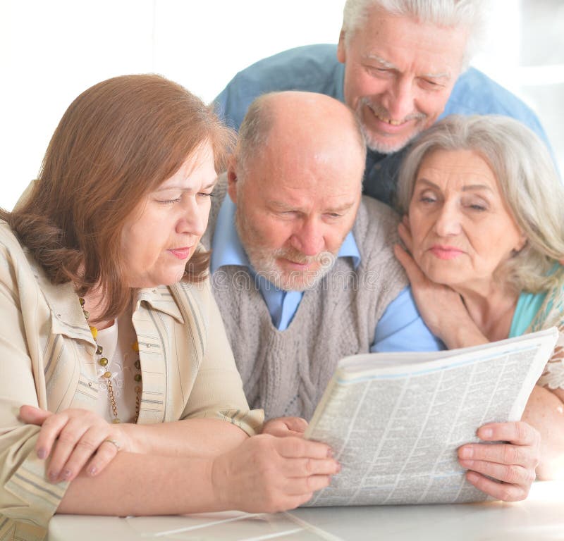 Senior Couples Reading Newspaper Stock Image - Image of male, happiness ...