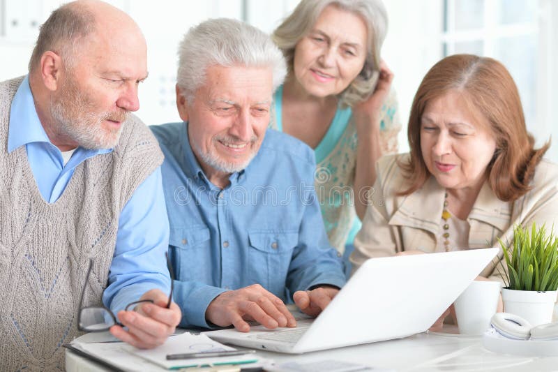 Senior Couples Reading Newspaper Stock Image - Image of older, resting ...