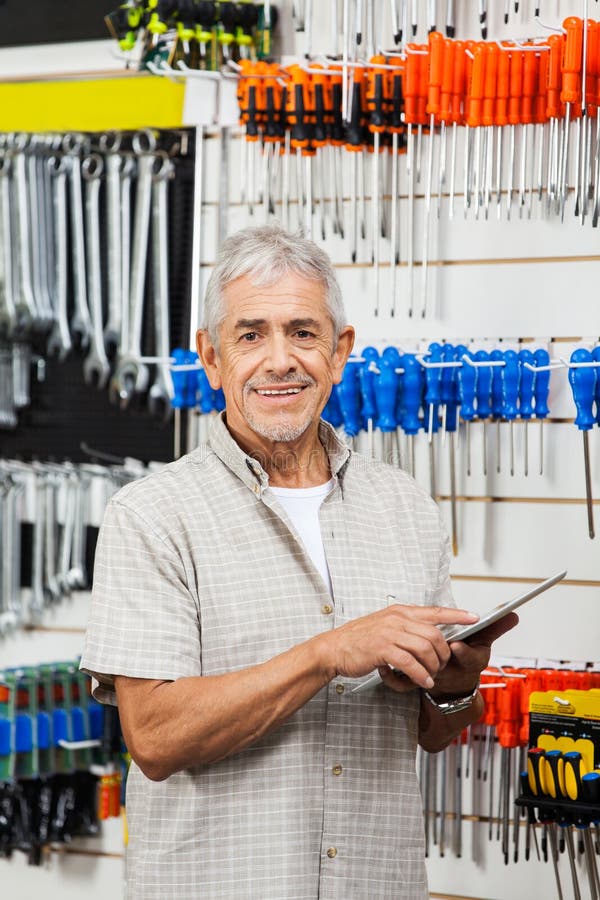 Senior Customer Using Tablet Computer in Hardware Stock Photo - Image ...
